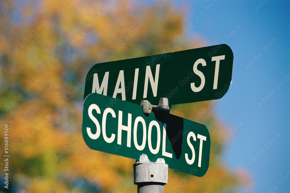 Sign post at corner of Main St. and School St. Stock Photo | Adobe Stock