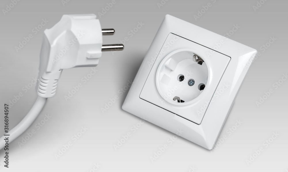 White electrical plug and the electric socket Stock Photo | Adobe Stock