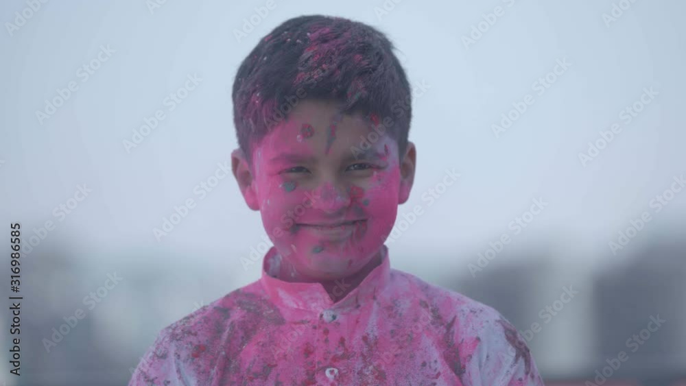 Boy enjoying festival of colors- Holi, an Indian Festival. Holi is ...
