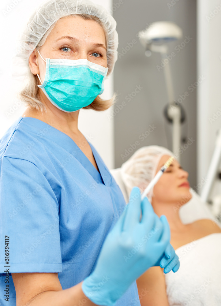 Professional cosmetologist preparing to perform procedures in modern ...