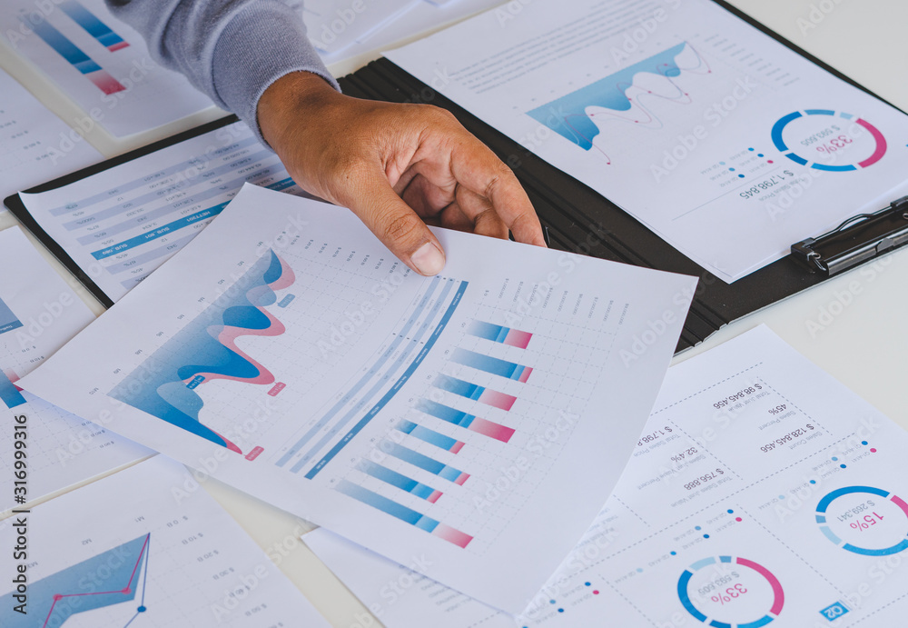 businessman working calculate data document graph chart report ...