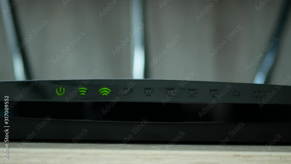 Close-up view of the LED lights blinking on wifi router, it connecting ...