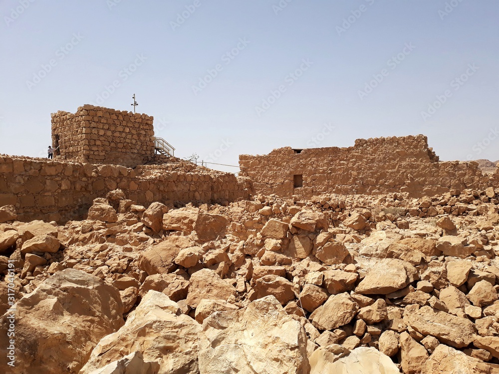 Ruins of the ancient Masada, a mountaintop fortress, near the Dead Sea ...