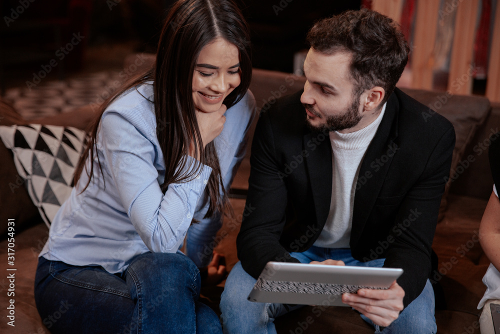 On the modern work office studio one good looking guy and pretty lady ...