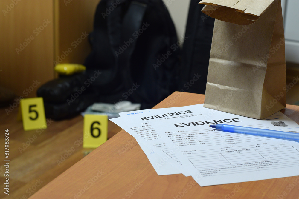 Evidence Chain of Custody Labels and brown paper bag lies with big ...
