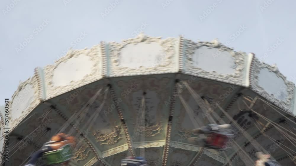 4k clip of people experiencing centripetal forces while riding a flying ...