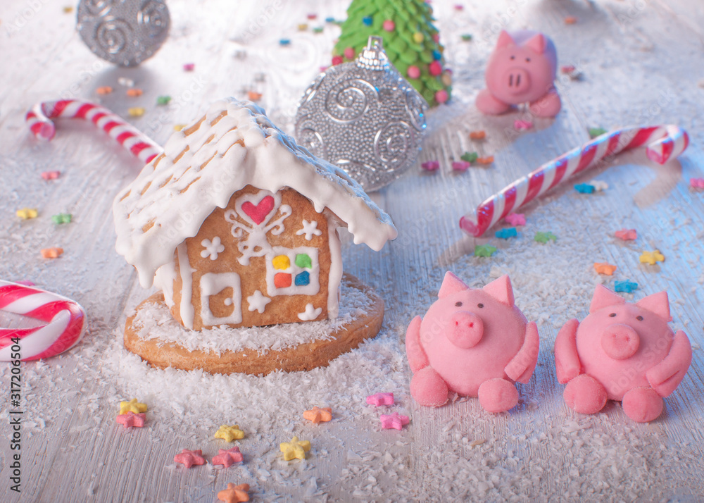 Gingerbread house and three little pigs. Stock Photo | Adobe Stock