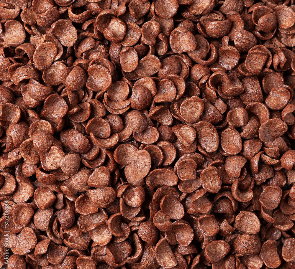 Chocolate cereal flakes background. Crispy chocolate crunch corn flakes ...