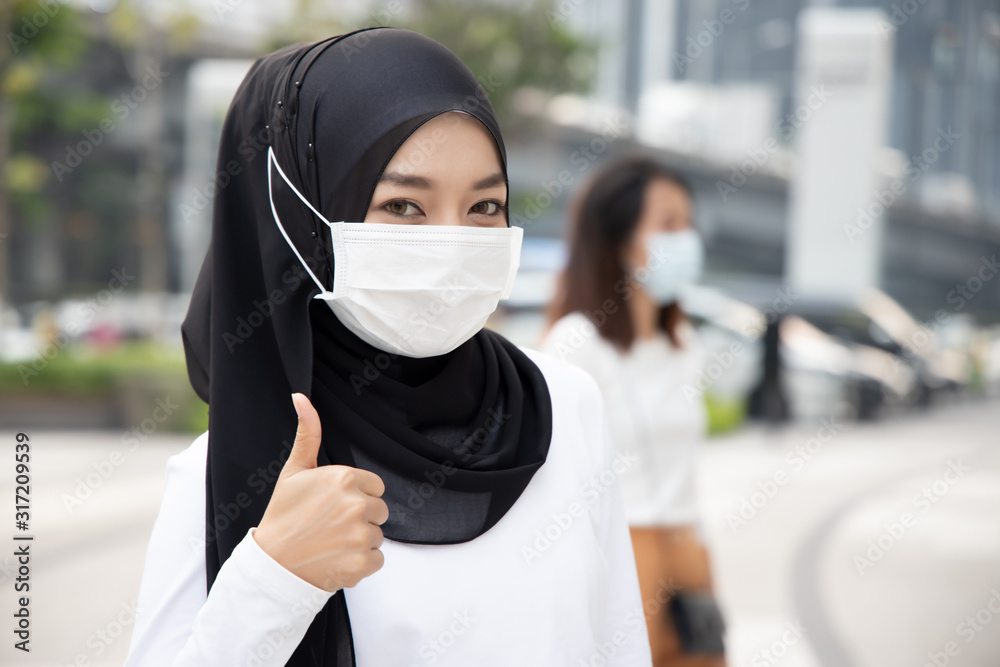 muslim woman wearing mask, stopping virus outbreak; concept of ...
