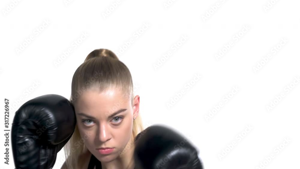Woman boxer kicking air. Female fighter training punch on white ...
