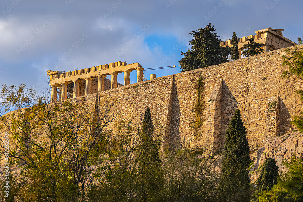Picturesque view of Greek ruins at the Acropolis hill on sunset. The ...