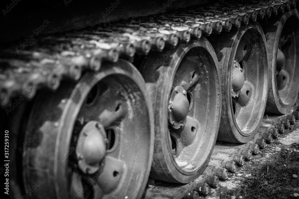 Detail shot with old tank tracks and wheels. view of the front part of ...