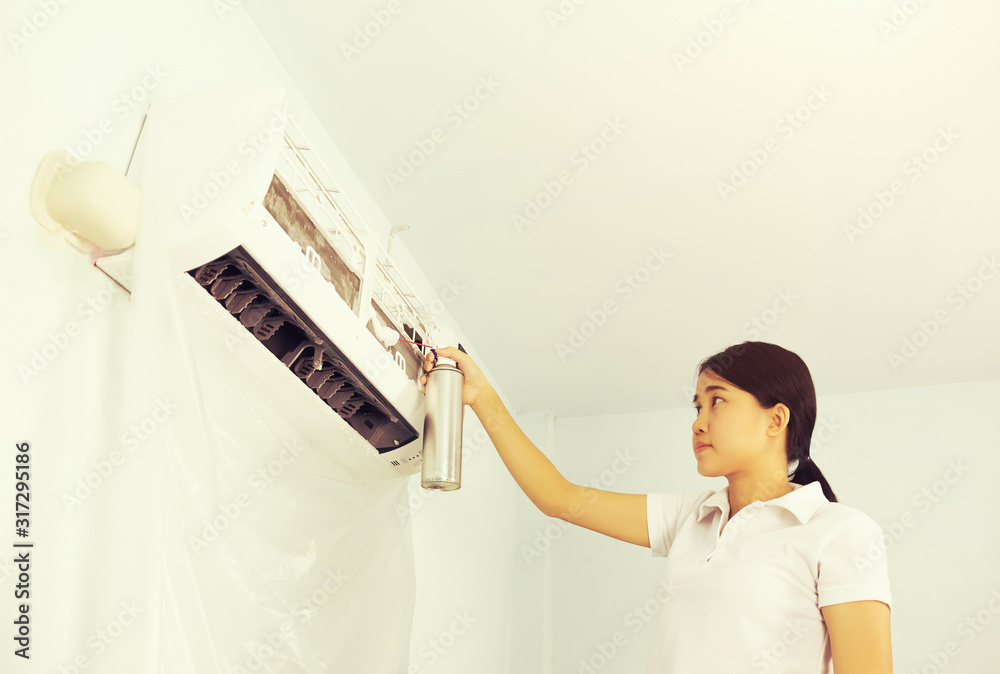 Air conditioner cleaning washing service. Asian woman or technician ...