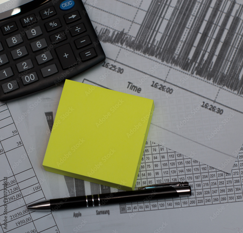 Calculator, pen, graph, white background Stock Photo | Adobe Stock