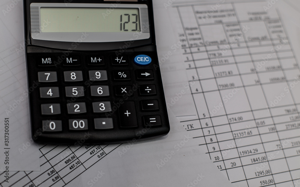 Calculator, pen, graph, white background Stock Photo | Adobe Stock