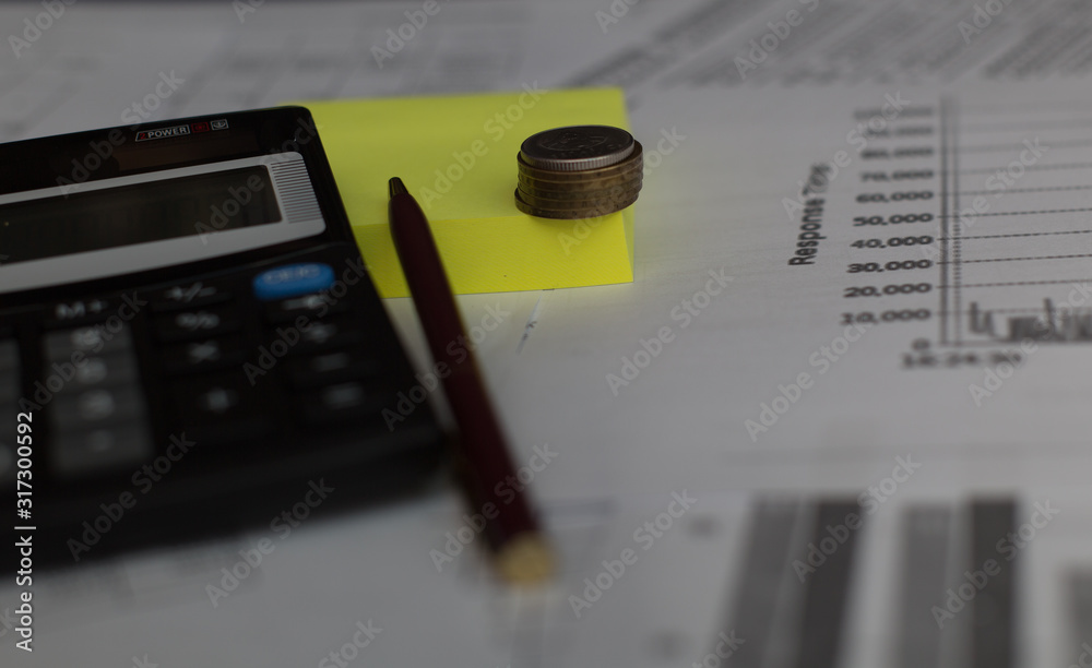 Calculator, pen, graph, white background Stock Photo | Adobe Stock