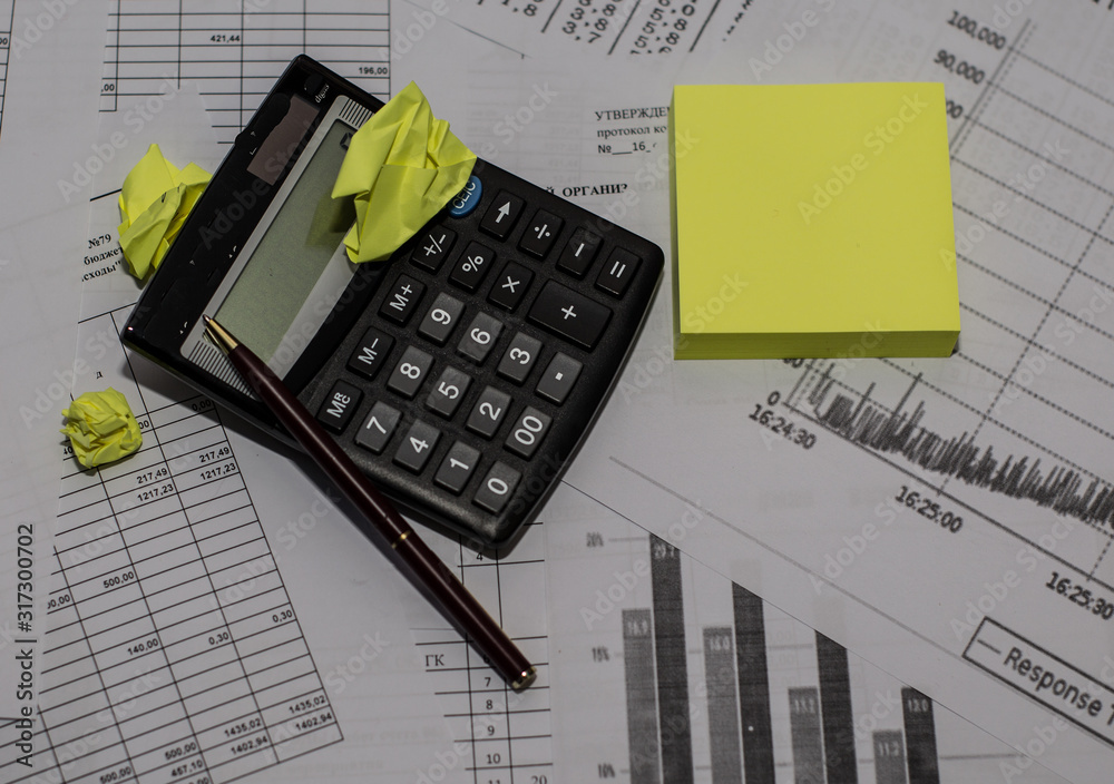 Calculator, pen, graph, white background Stock Photo | Adobe Stock