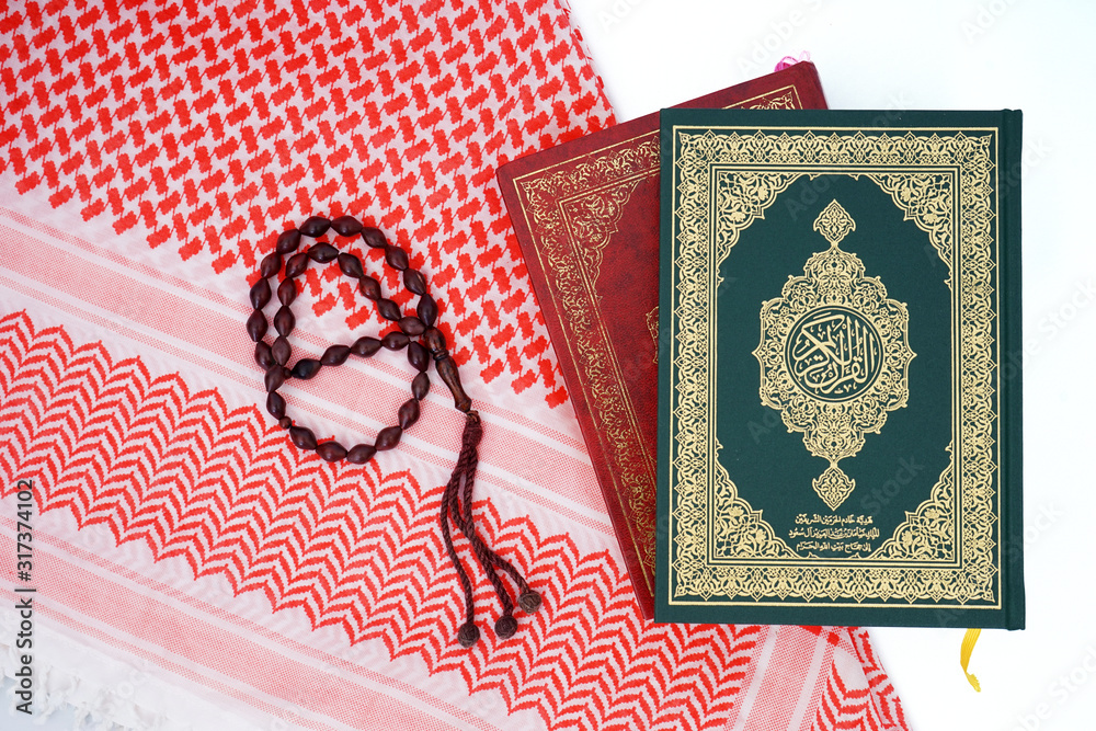 Quran and shemagh fabric - holy book of Muslims - Koran - quran on ...