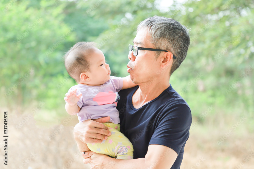 old man and his cute baby, both of them are smiling happily, Use it for ...