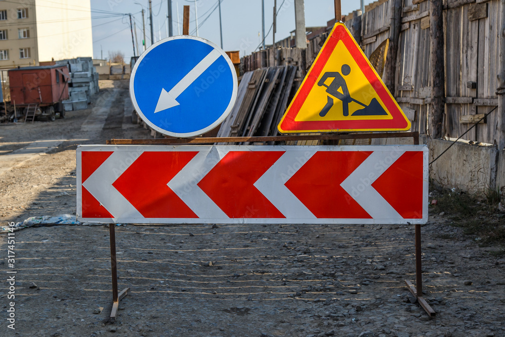 Work in progress. Roadworks, road signs. Men at work. Some signs ...