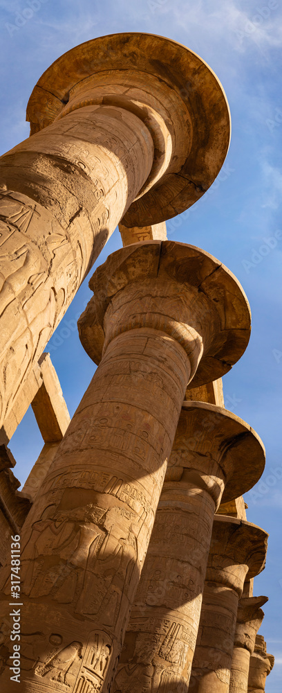 Karnak Temple, complex of Amun-Re. Embossed hieroglyphics on columns ...