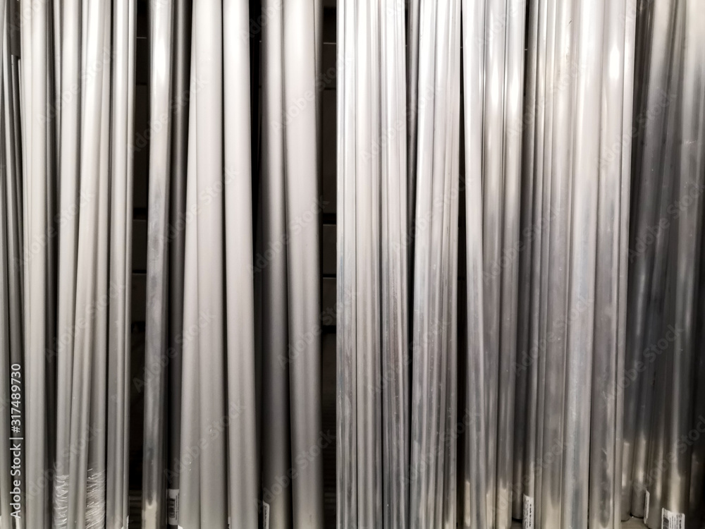 Aluminum pipes. Texture of metal pipes of the same diameter. The ...