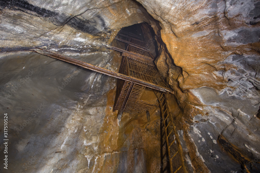 Old gold mine underground vertical shaft bottom view with stairs ...
