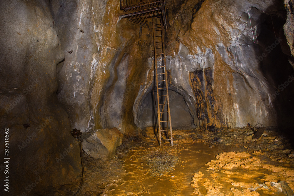 Old gold mine underground vertical shaft bottom view with stairs ...