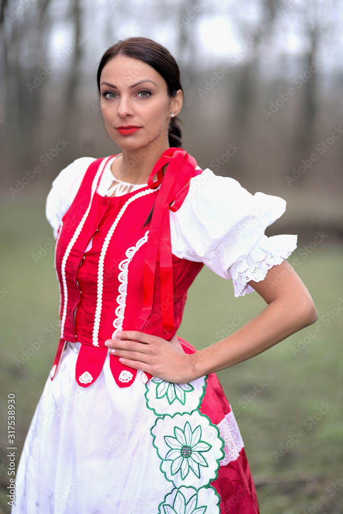 Young beautiful slovak woman in traditional costume. Slovak folklore ...