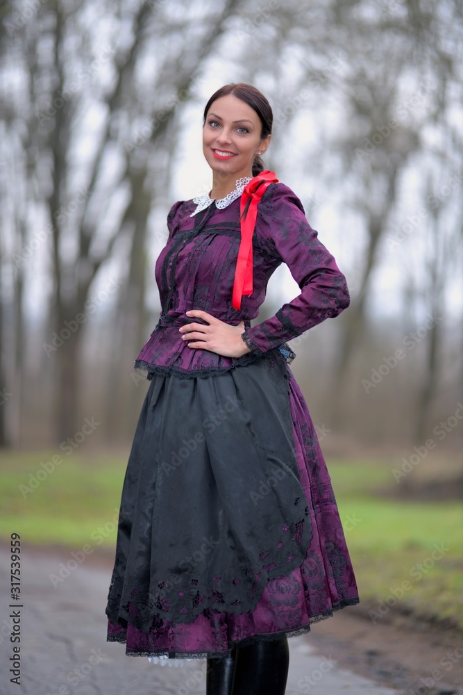 Young beautiful slovak woman in traditional costume. Slovak folklore ...