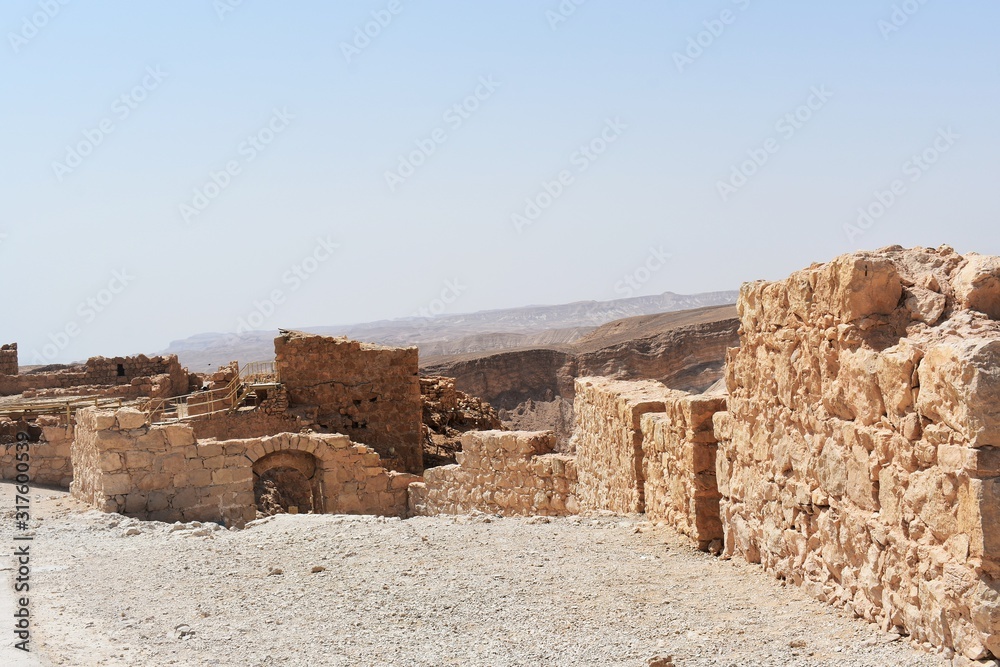 Ruins of the ancient Masada, a mountaintop fortress, near the Dead Sea ...