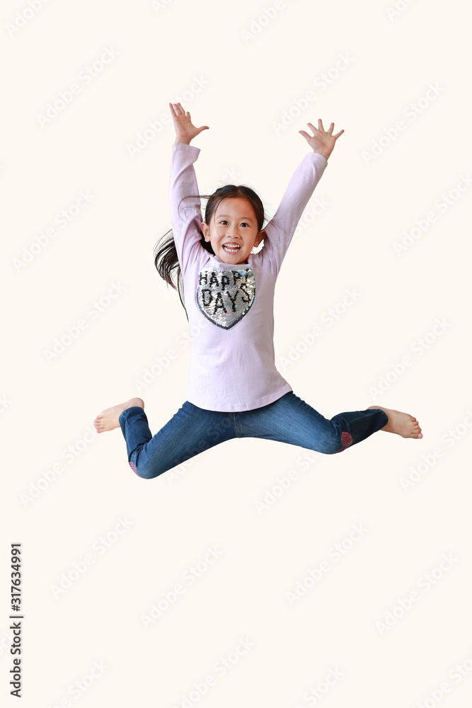 Funny little Asian child girl jumping and freedom movement on air ...