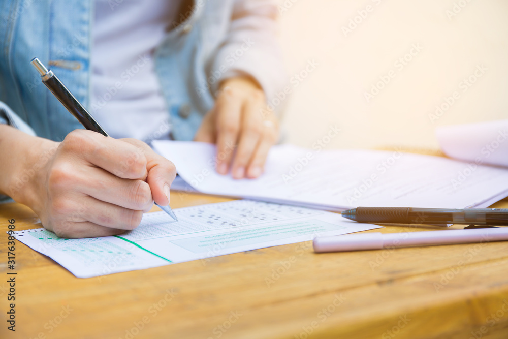 high school,university student study.hands holding pencil writing paper ...