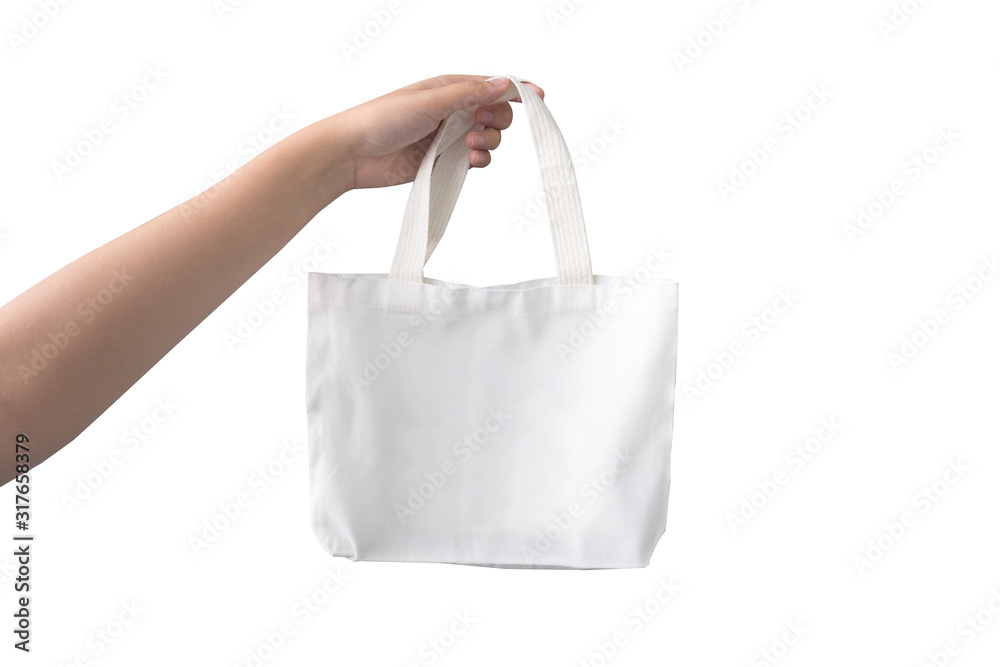 women hand holding cloth white bag isolated on white background with ...