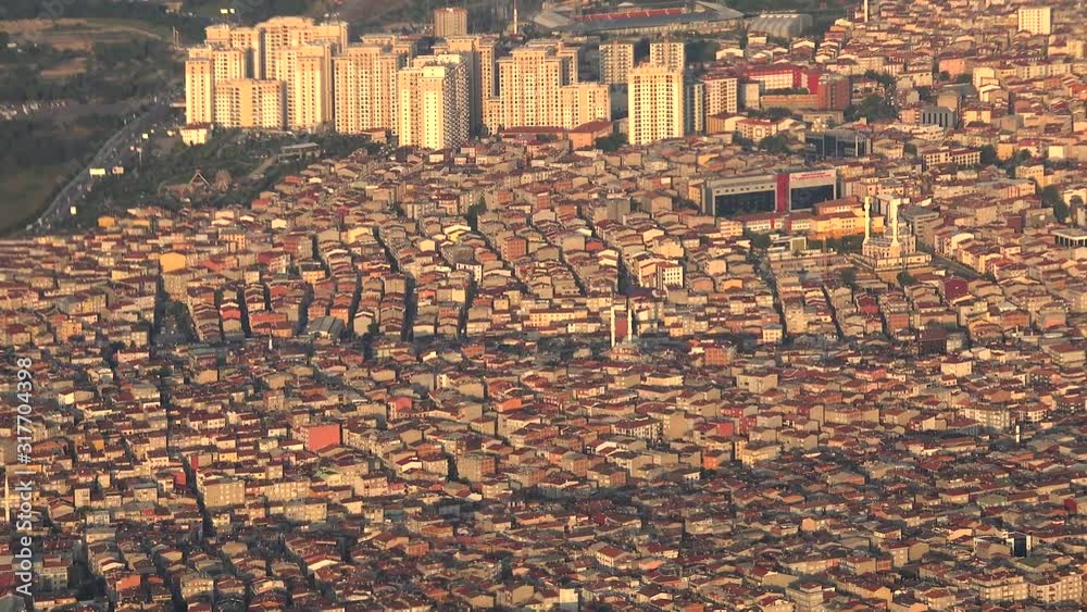Overpopulated metropolis. Crowded congested city from airplane. Mosques ...