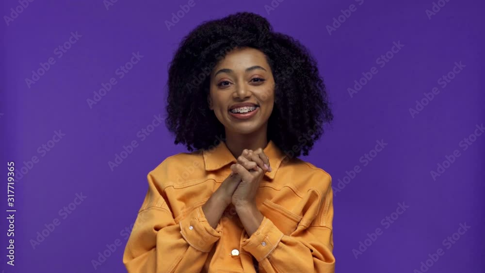 smiling african american woman nodding isolated on purple Stock Video ...