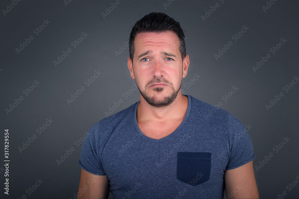 Beautiful face of sad man crying desperate and depressed with tears on ...