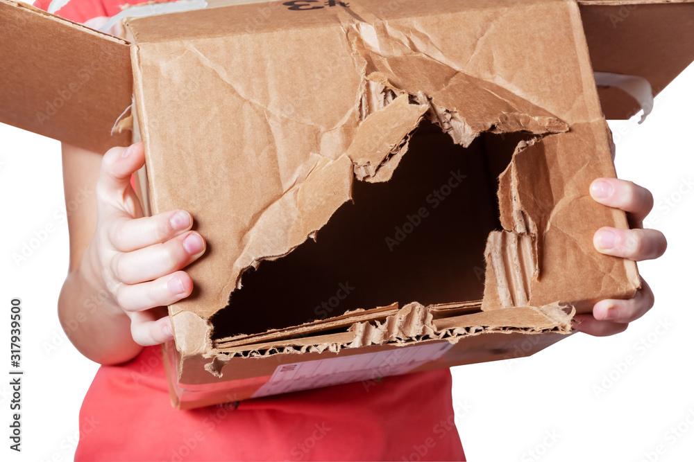 child holds a cardboard box with a hole Stock Photo | Adobe Stock