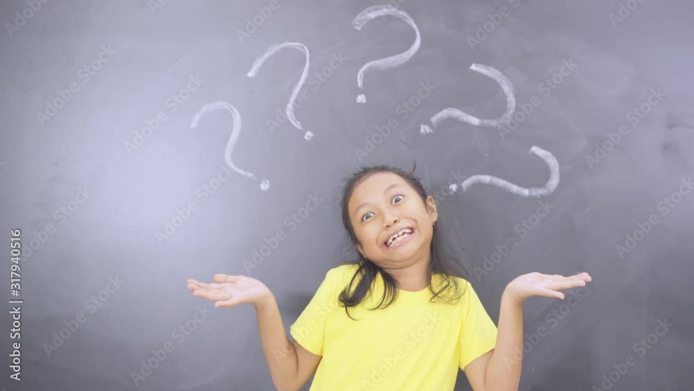 Confused little girl standing with question marks vídeo do Stock ...
