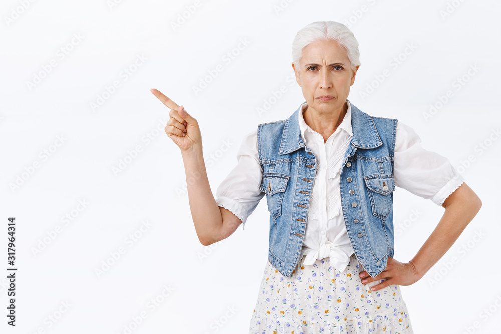 Angry, serious-looking disappointed senior lady, grandmother displeased ...