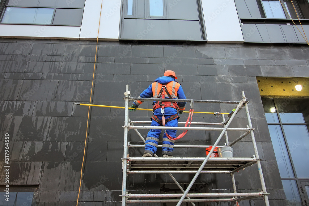 Penthouse Construction. building under restoration. scaffoling on ...