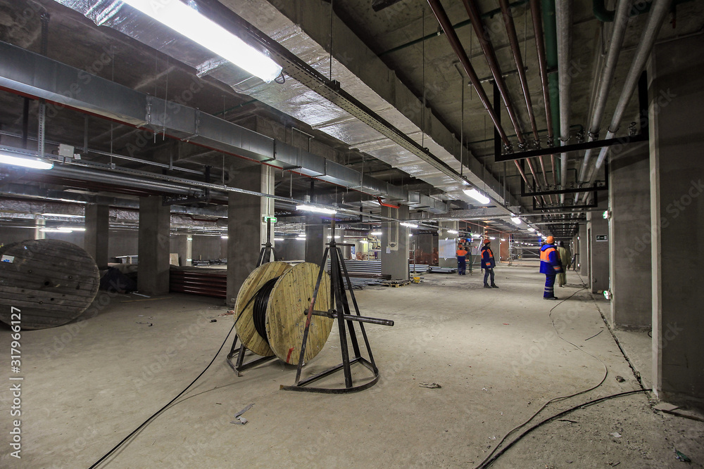 Underground parking in construction phase. Empty garage in basement of ...
