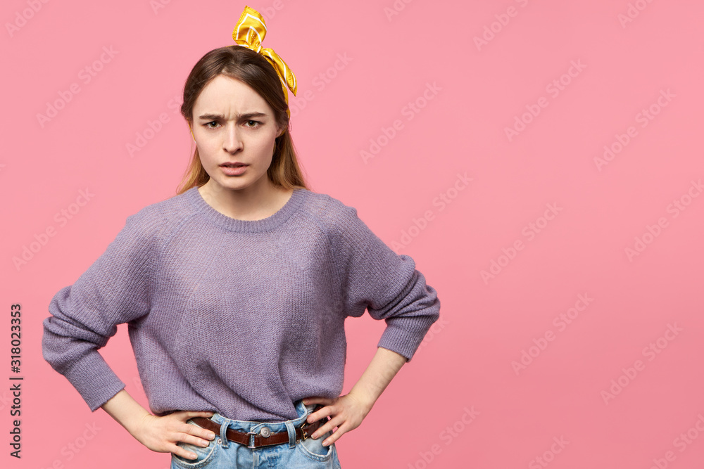 What the hell? Displeased angry young woman in fashionable clothes ...