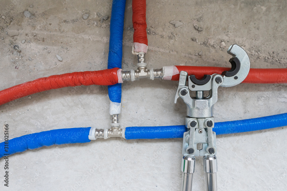 Plumbing copper pipe crimper press tube tool. Heating pipes connected ...