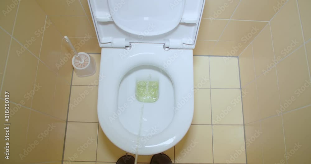 Slow motion shot, peeing, urinating in toilet, first person view ...