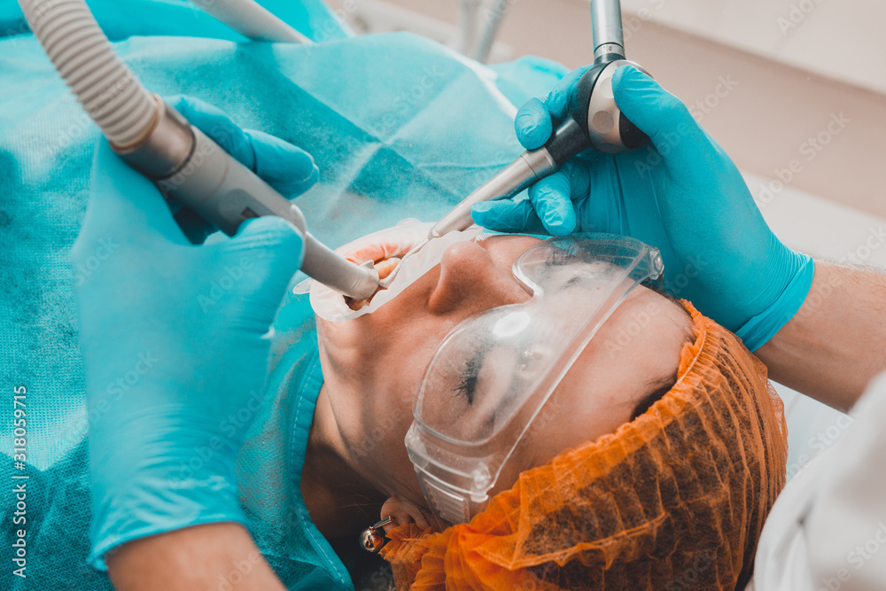 The patient visits the dentist regarding the procedure of ultrasonic ...