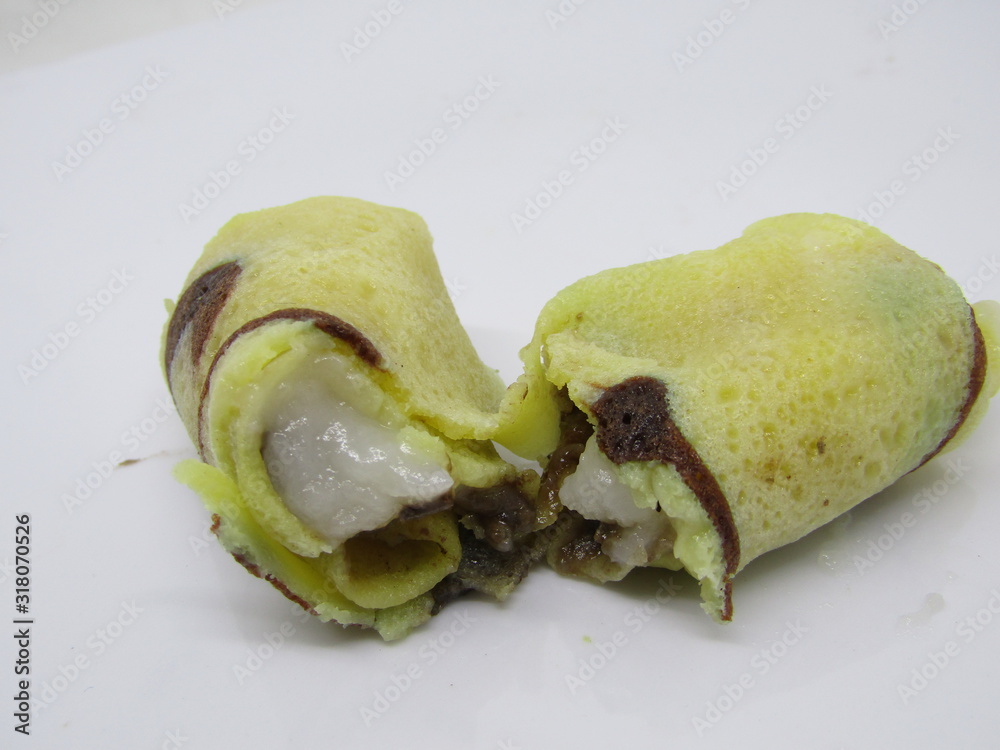 Close up view of kue basah or wet snack dadar gulung parutan kelapa ...