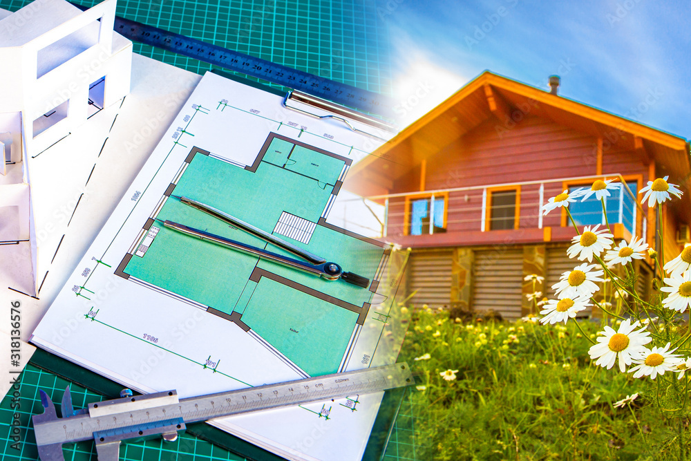 Construction drawings next to a photograph of a finished house ...