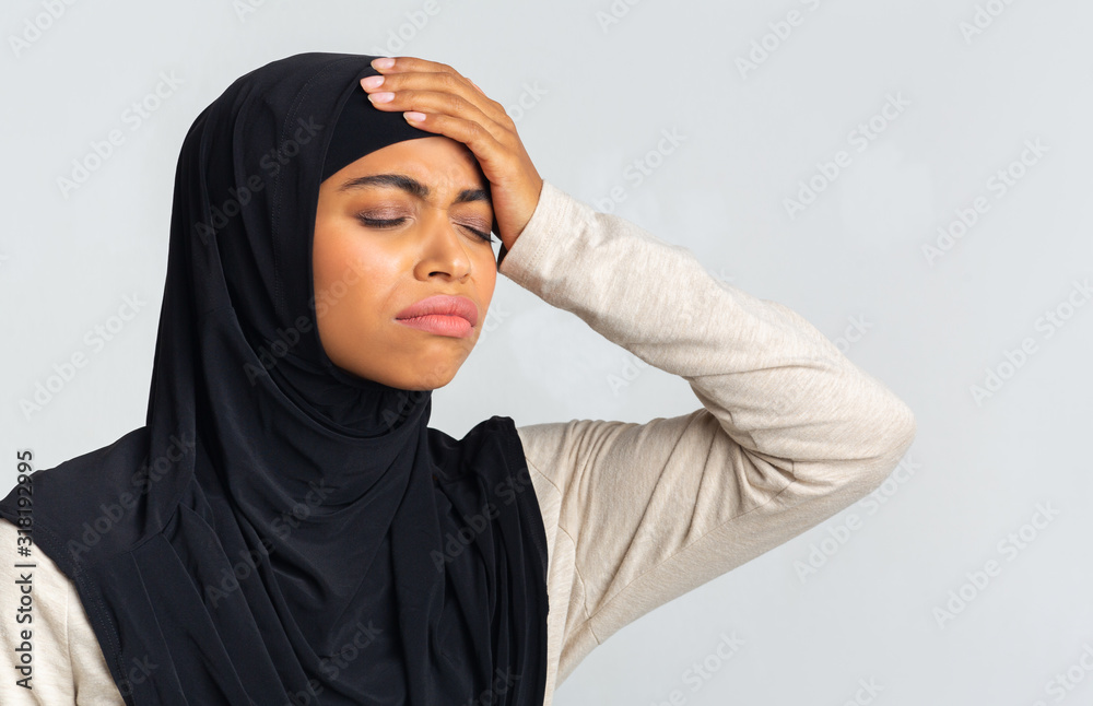 Black Islamic Woman In Hijab Touching Her Forehead, Suffering From ...