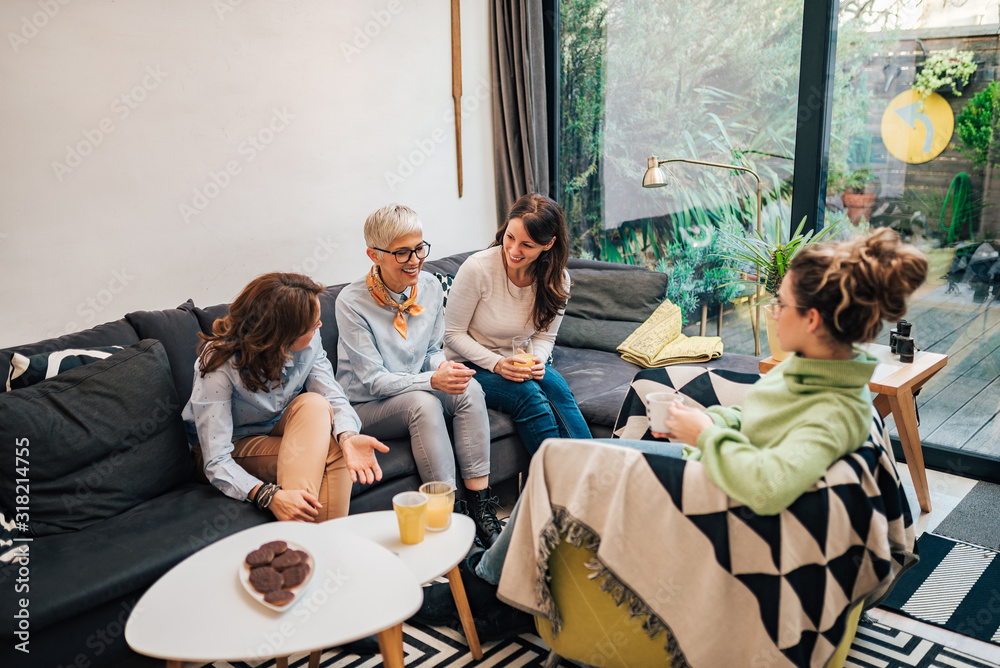 Happy multi-generational family gathering at modern home. Stock Photo ...